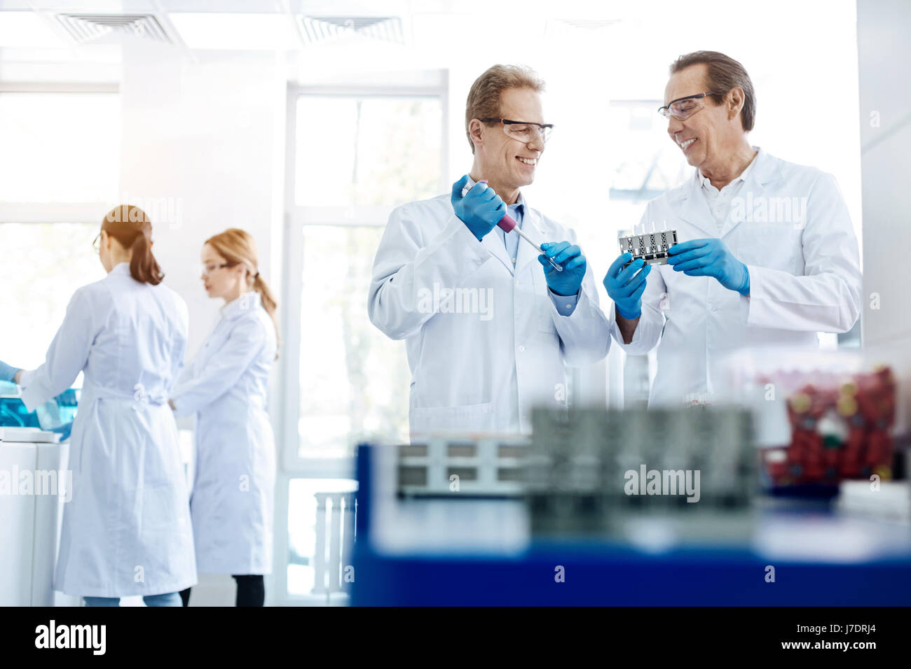 Two men discussing their invention Stock Photo - Alamy