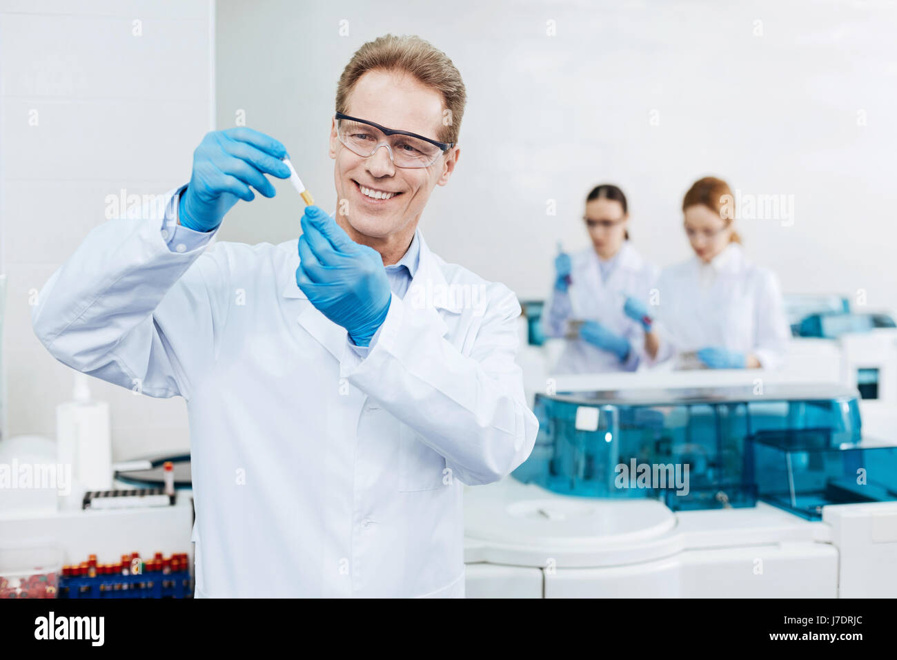 Handsome smiling male scientist looking forward Stock Photo - Alamy