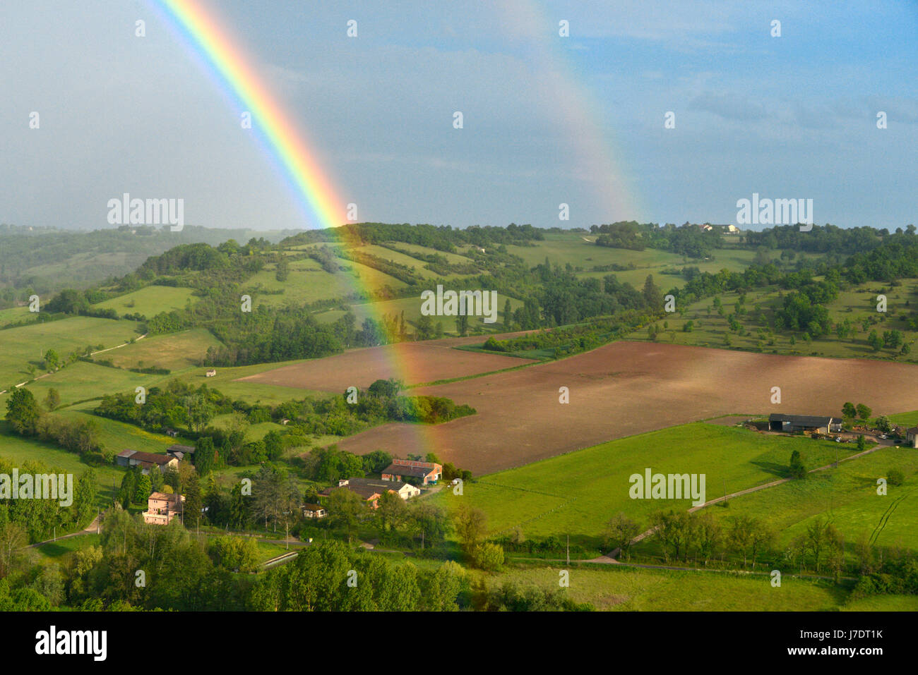 Double rainbow over French farmland Stock Photo - Alamy