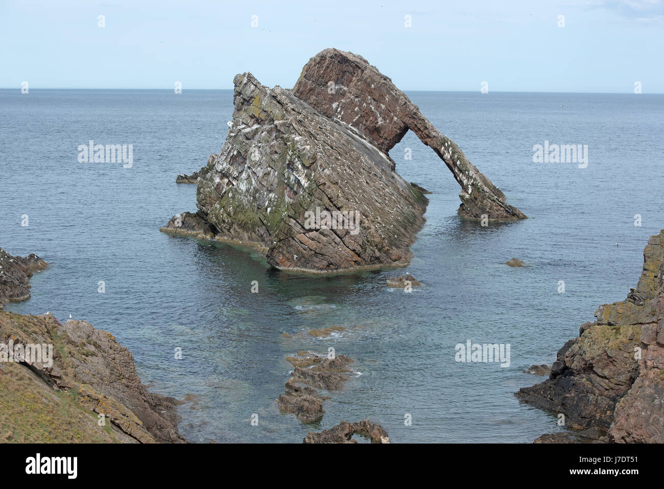 Portknockie known for its natural offshore rock arch Stock Photo - Alamy