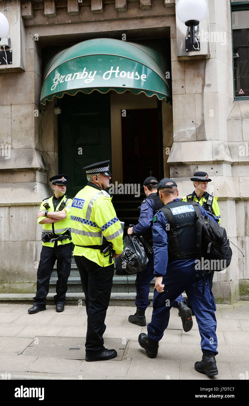Police from the Tactical Aid Unit enter Granby House in Granby Row ...