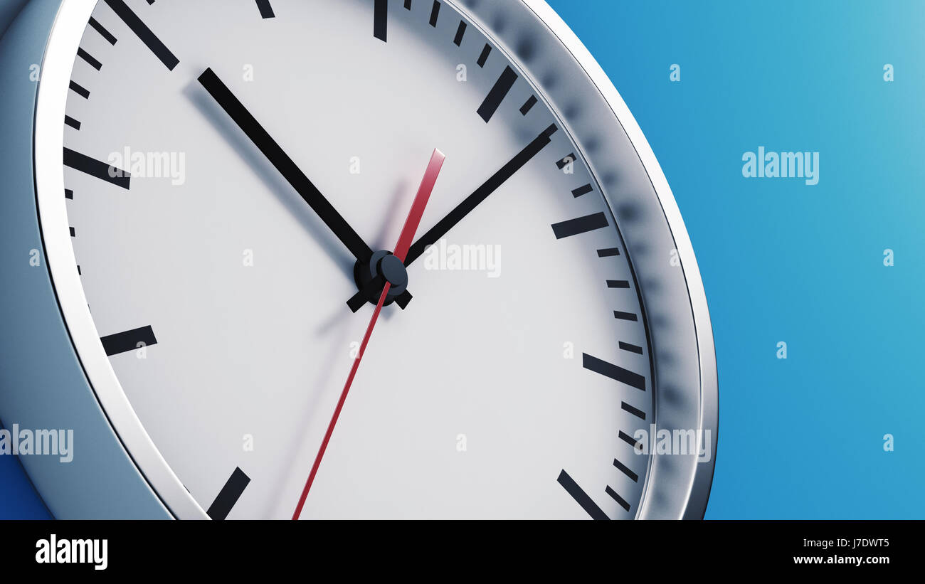 Clock hanging at the wall isolated on blue Stock Photo - Alamy