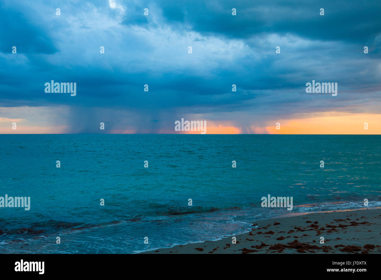 Rain storms over the Gulf of Mexico at sunset on the west coast of ...