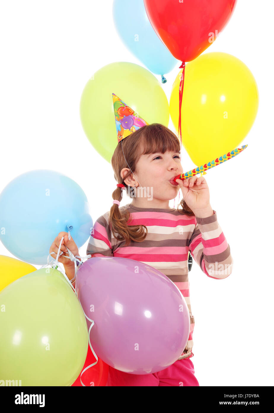 happy little girl with trumpet hat and balloons birthday party Stock ...