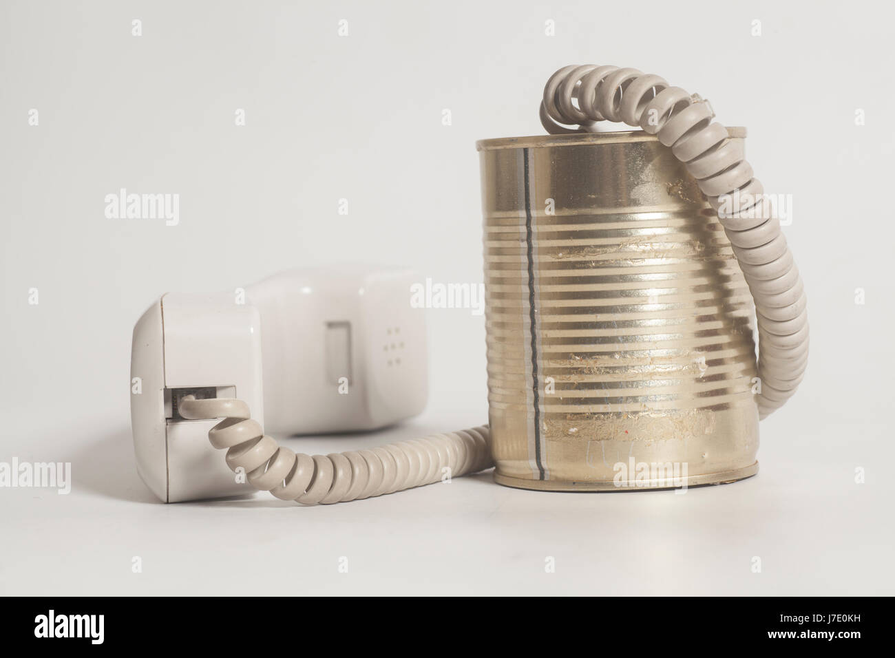 Tin can phone with handset on white background Stock Photo - Alamy