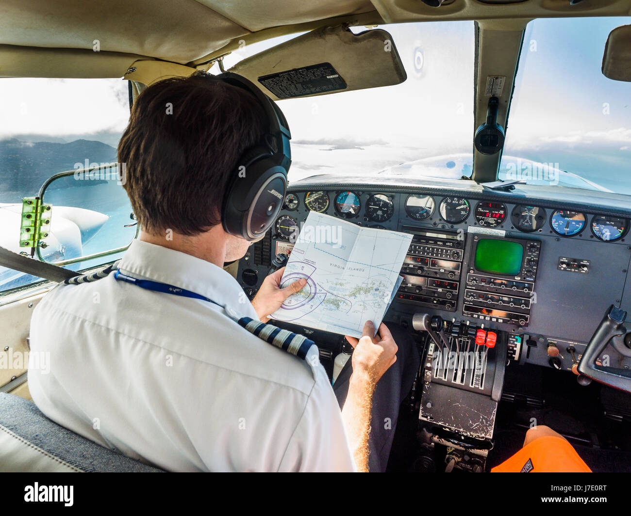 lost confused pilot consults map while flying Stock Photo - Alamy