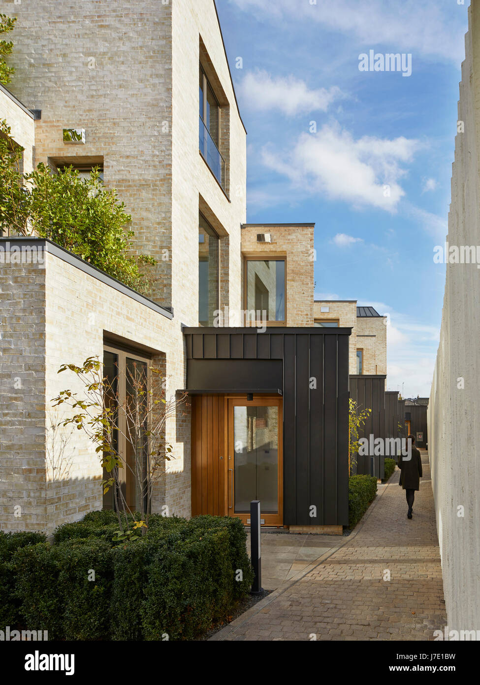 Entrance facades with cobbled walkway. Paradise Gardens, London, United ...