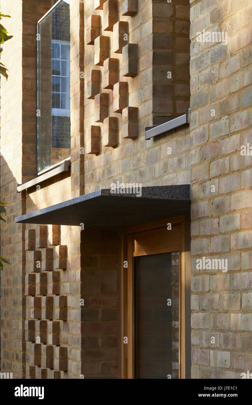 Brickwork detail and entrance canopy. Paradise Gardens, London, United ...