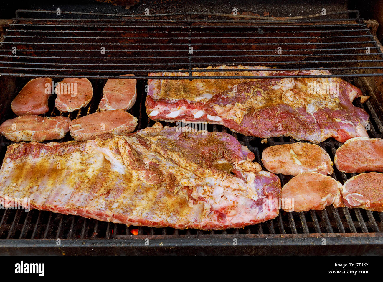 BBQ Baby Back Or Spareribs Ribs Close-up On The Hot Flaming Grill Fire ...