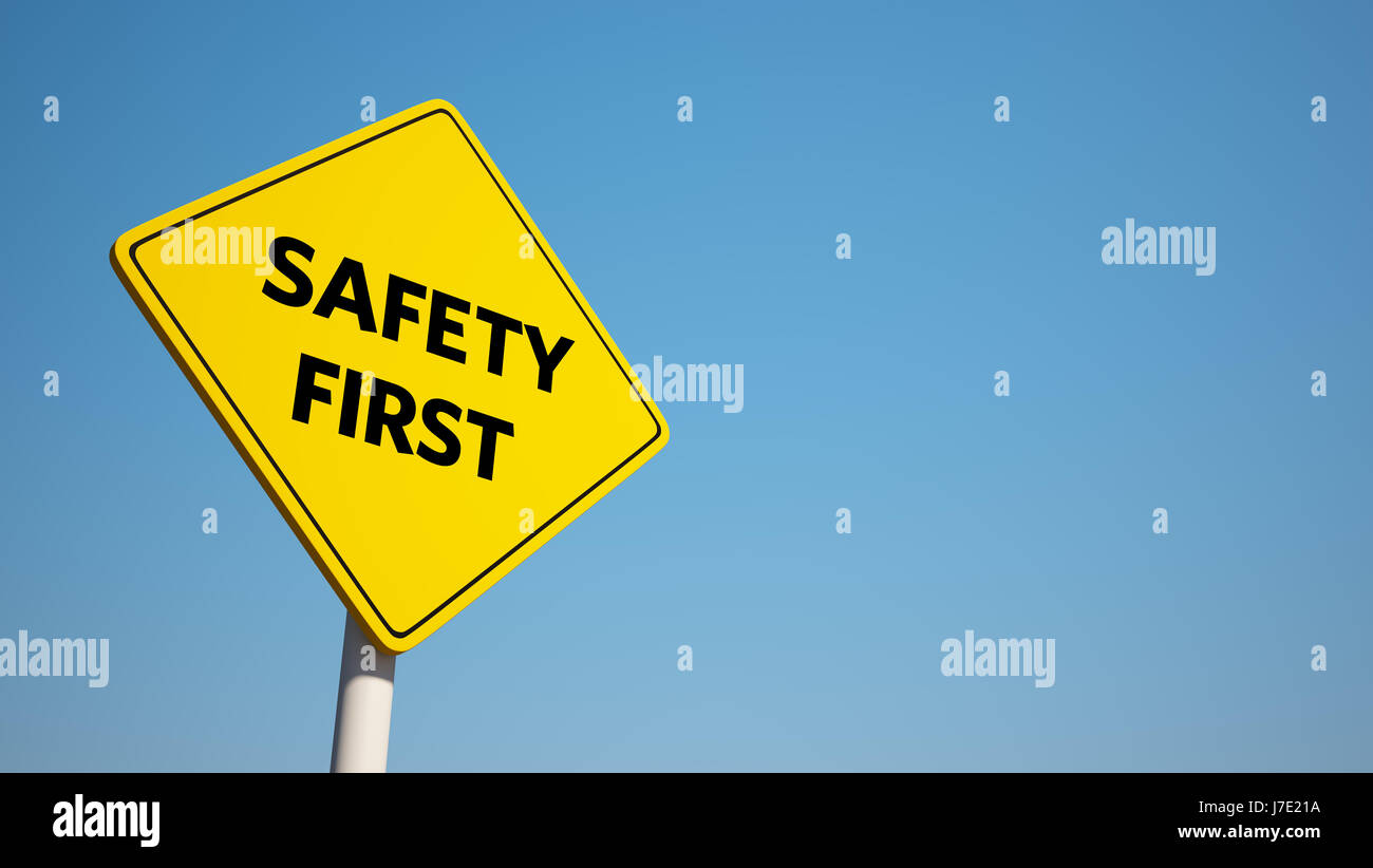 Safety Sign isolated on clean blue sky Stock Photo - Alamy