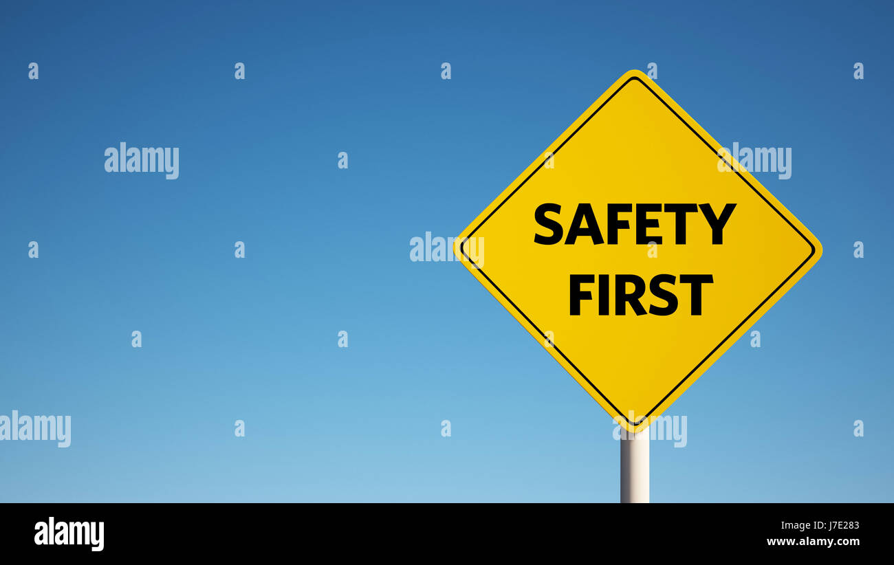 Safety Sign isolated on clean blue sky Stock Photo - Alamy