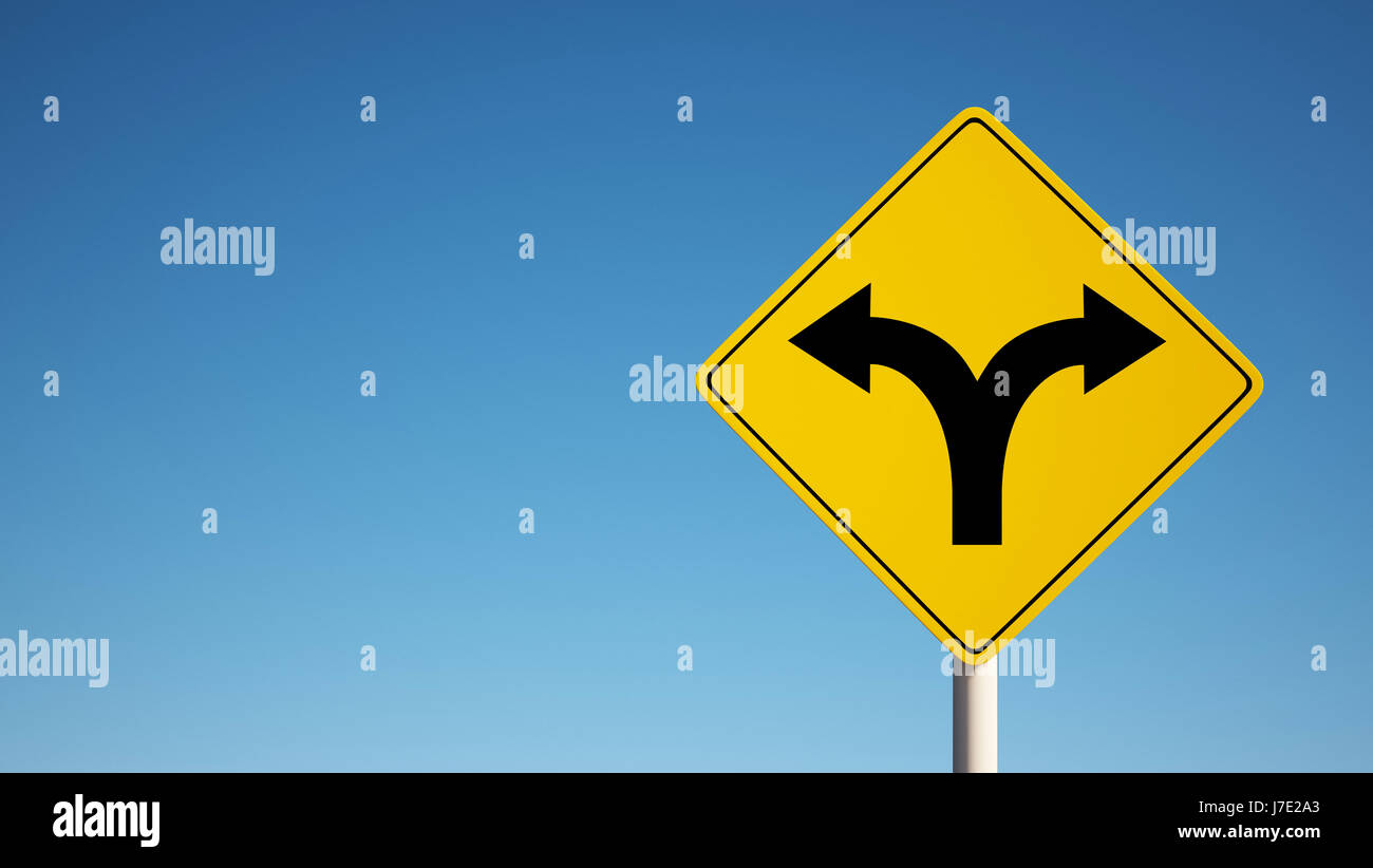 Dividing Sign isolated on clean blue sky Stock Photo - Alamy