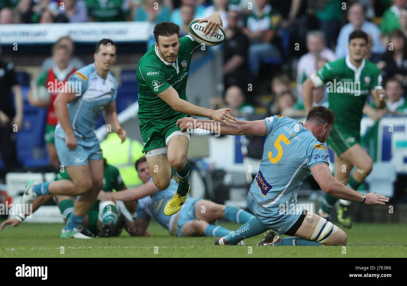 London Irish's Tommy Bell steps inside the tackle of Yorkshire Carnegie ...
