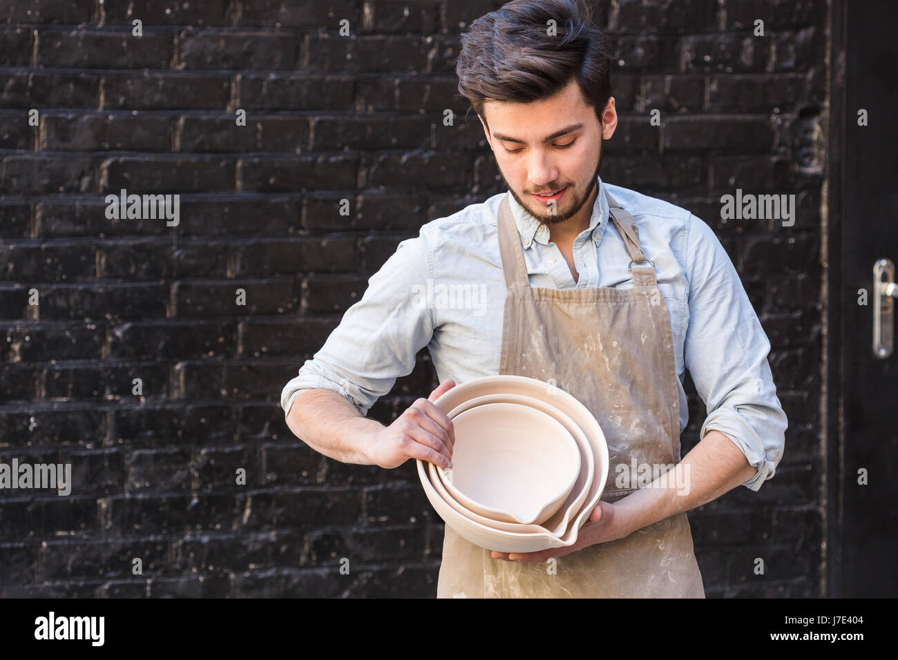 potter, utensils, ceramics art concept - smiling male ceramist in the ...
