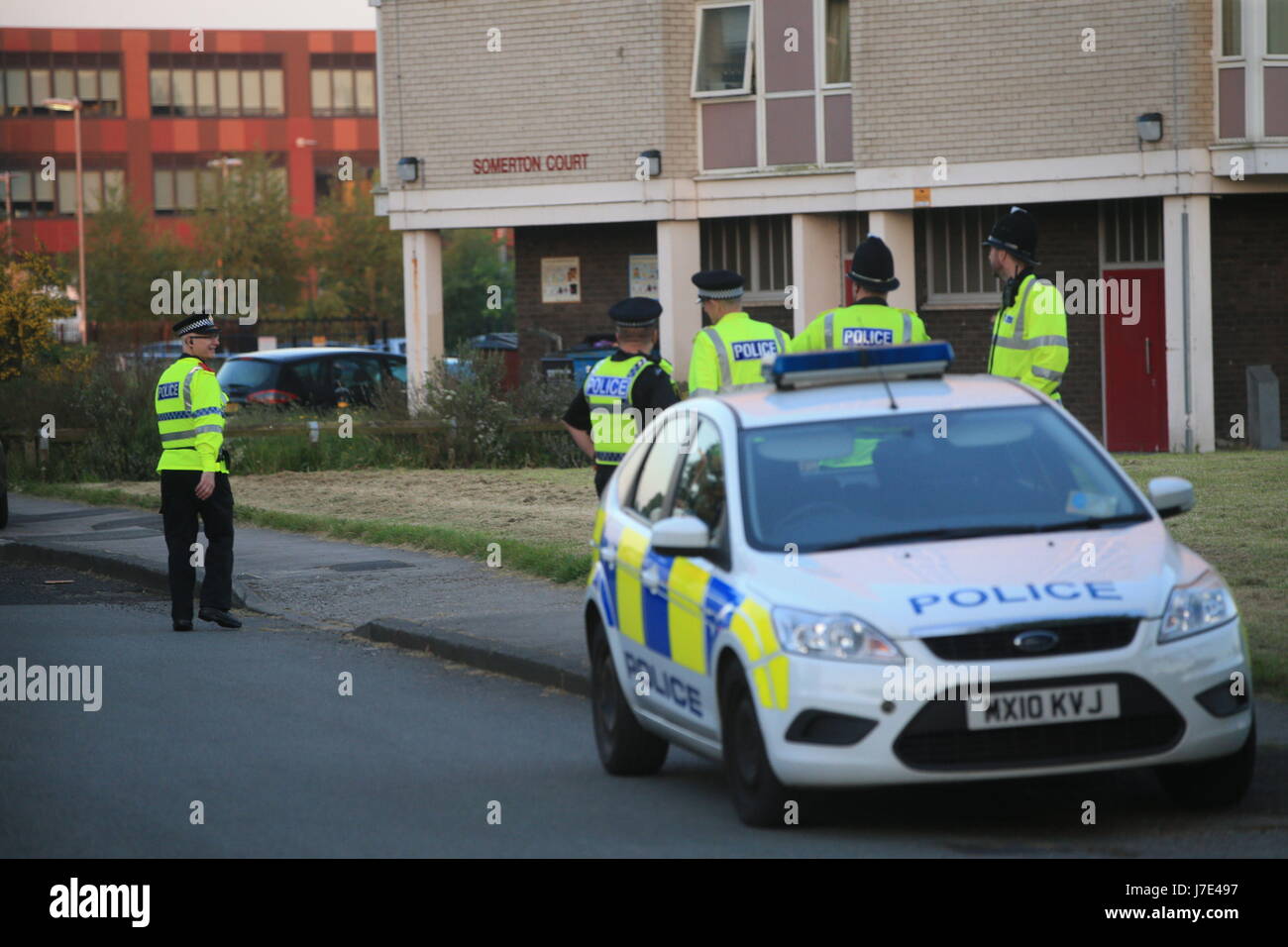 Police outside a block of flats they raided in Blackley, north ...