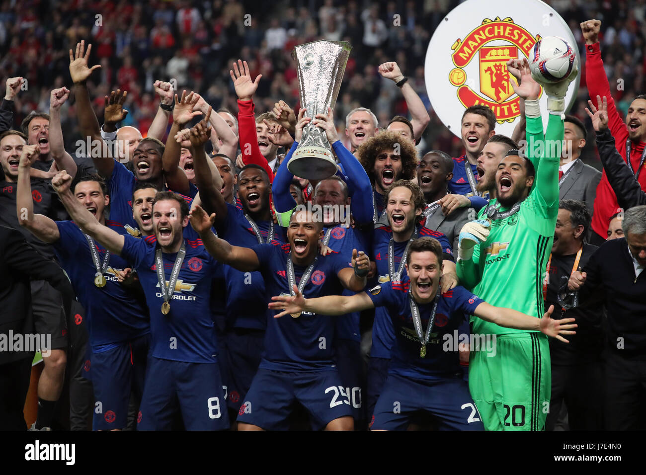 Manchester United's Wayne Rooney lifts the trophy as his team-mates ...