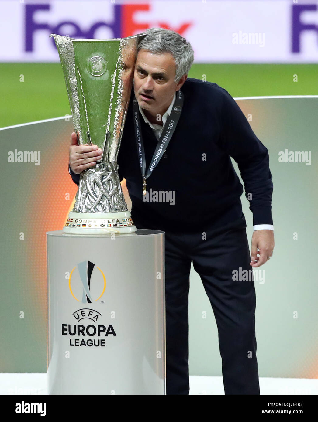 Manchester United manager Jose Mourinho poses with the trophy after ...