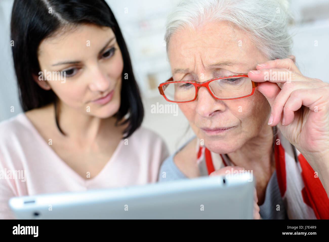 Female carer helping elderly lady hi-res stock photography and images ...