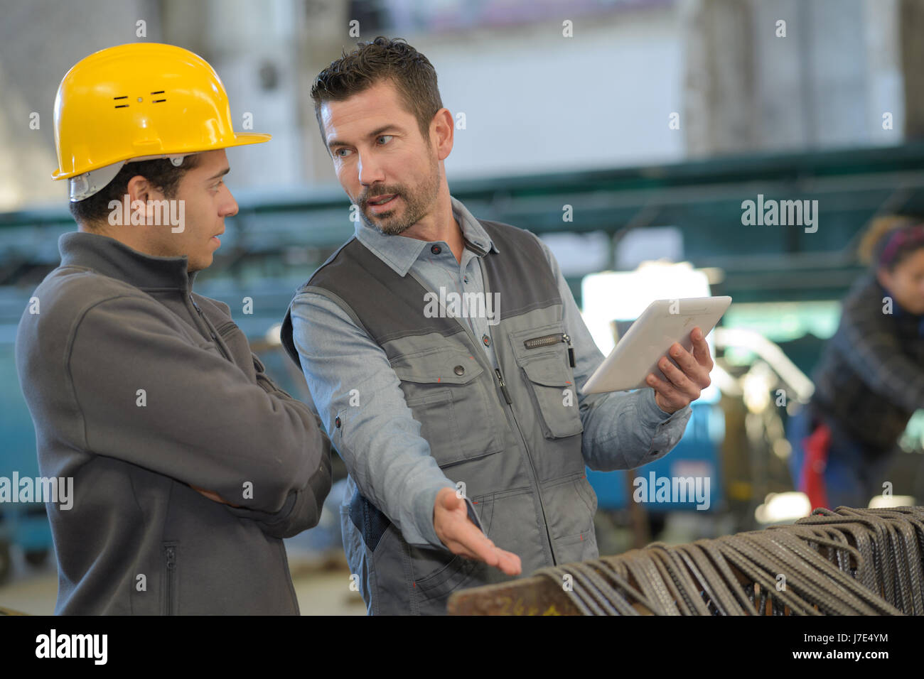 construction worker pointing at digital tablet close-up Stock Photo - Alamy