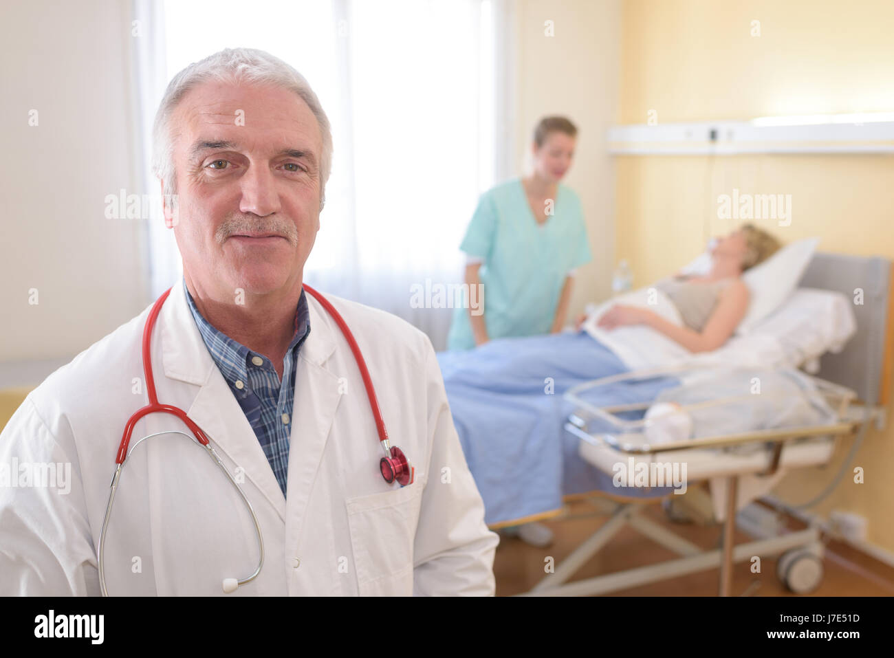 gynecologist posing and smiling Stock Photo - Alamy