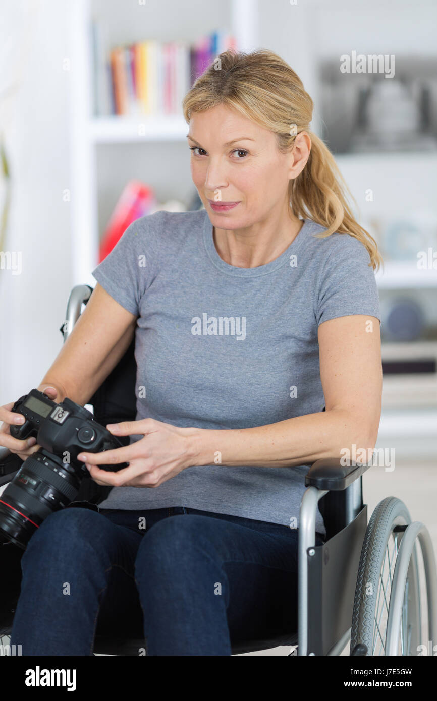 disabled woman holding a camera Stock Photo - Alamy