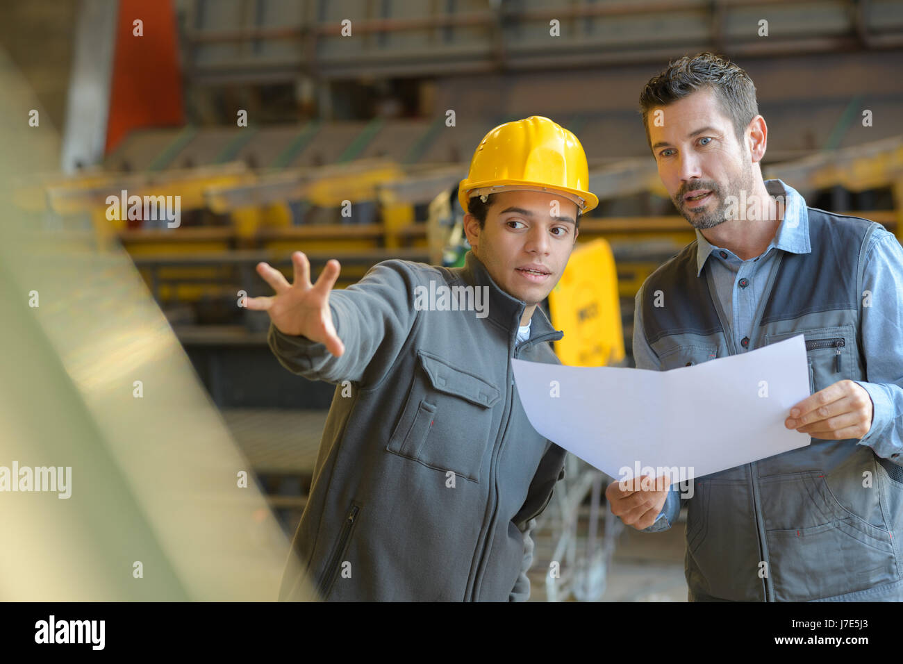 workers at a manufacturing area Stock Photo - Alamy
