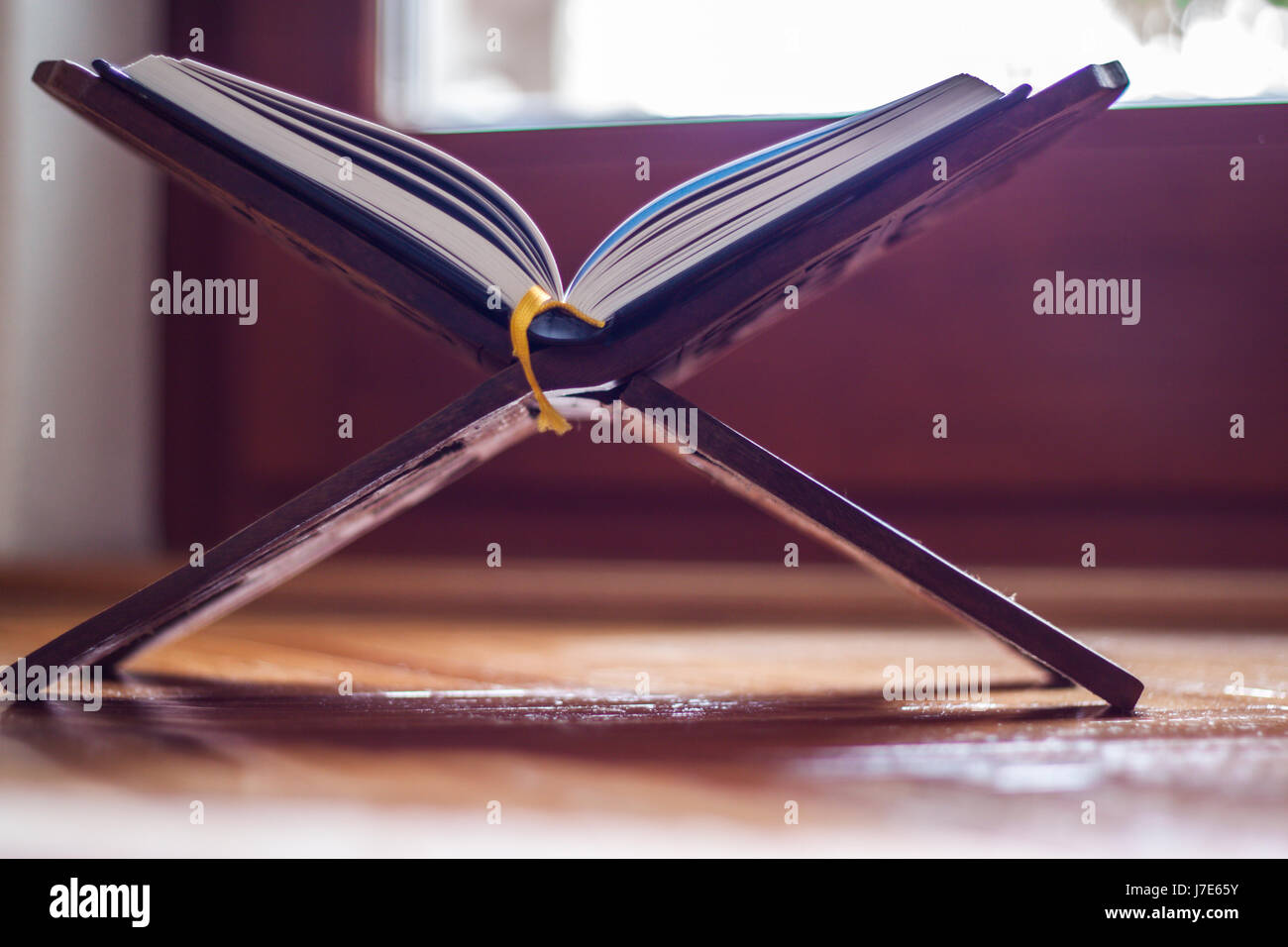 Quran-holy book of Muslims, an open book on a stand with rosary Stock ...