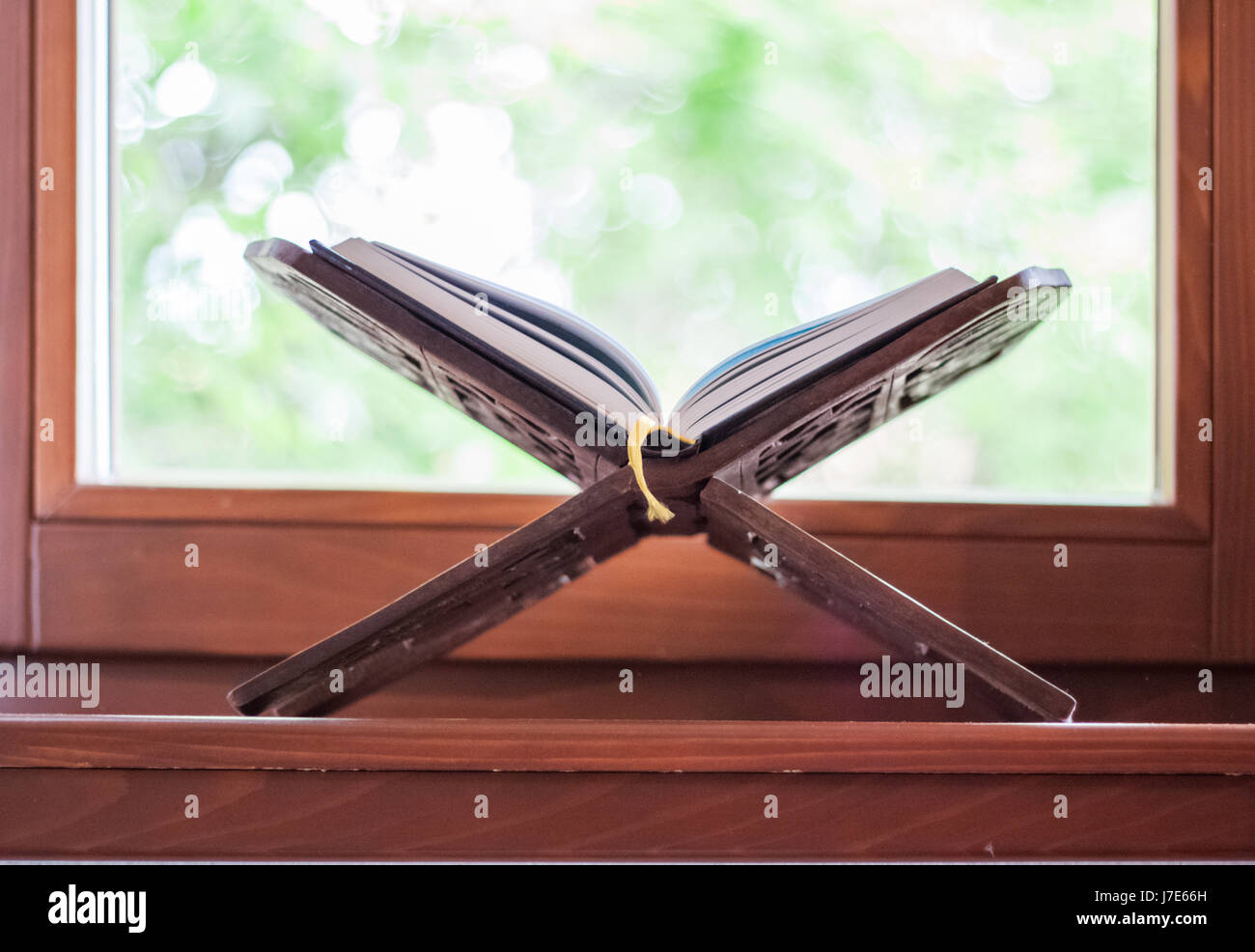 Quran-holy book of Muslims, an open book on a stand with rosary Stock ...