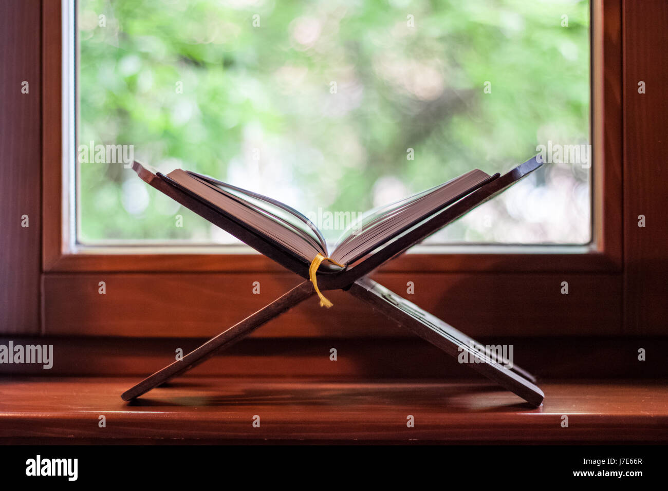 Quran-holy book of Muslims, an open book on a stand with rosary Stock ...