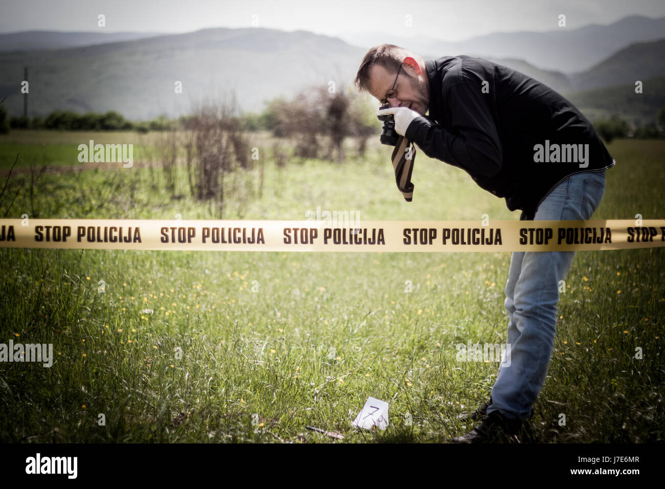 The crime scene, murder, investigation, bloody knife on the grass, an ...