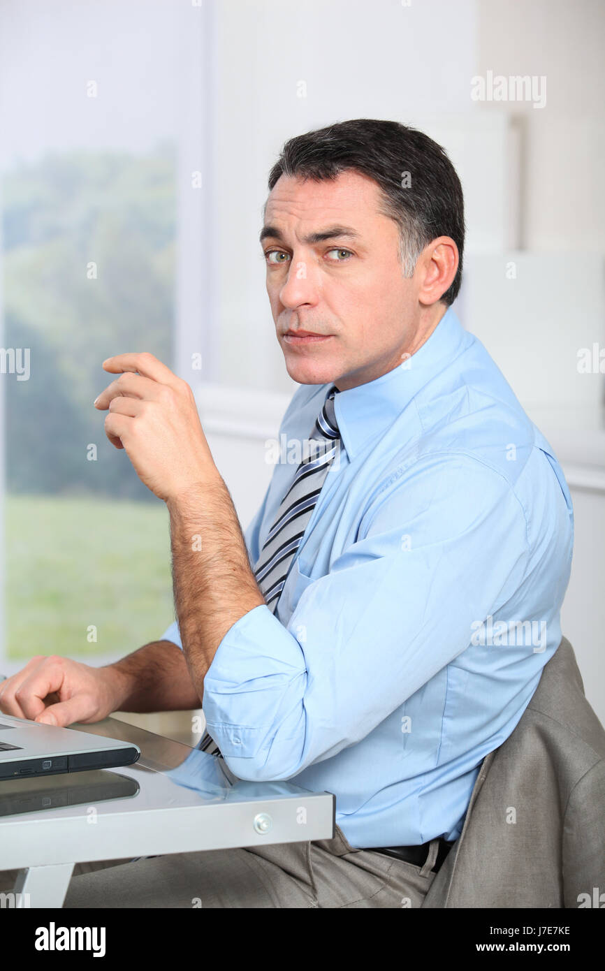 blue office laptop notebook computers computer desk closeup portrait ...