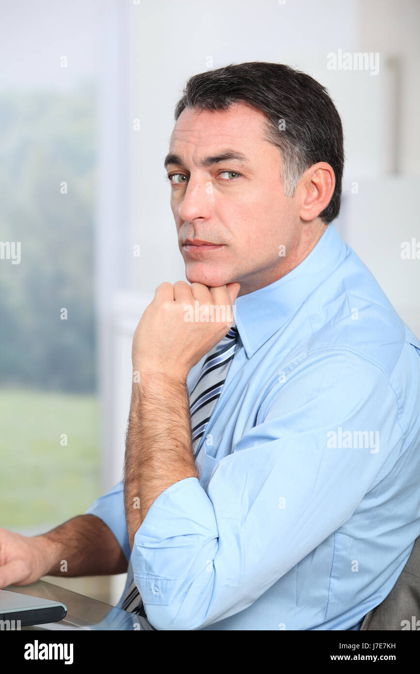 blue office laptop notebook computers computer desk closeup portrait ...