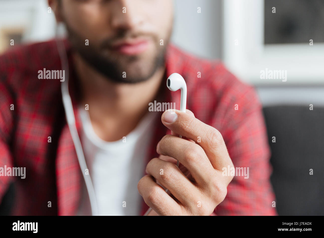 Hand in the earphone hi-res stock photography and images - Alamy
