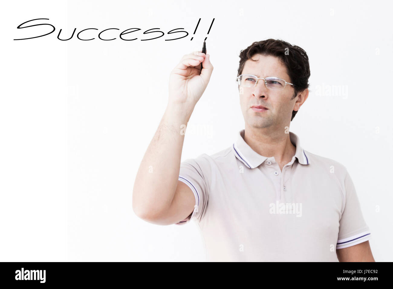 Man writing "Success!!" on a transparent surface Stock Photo - Alamy