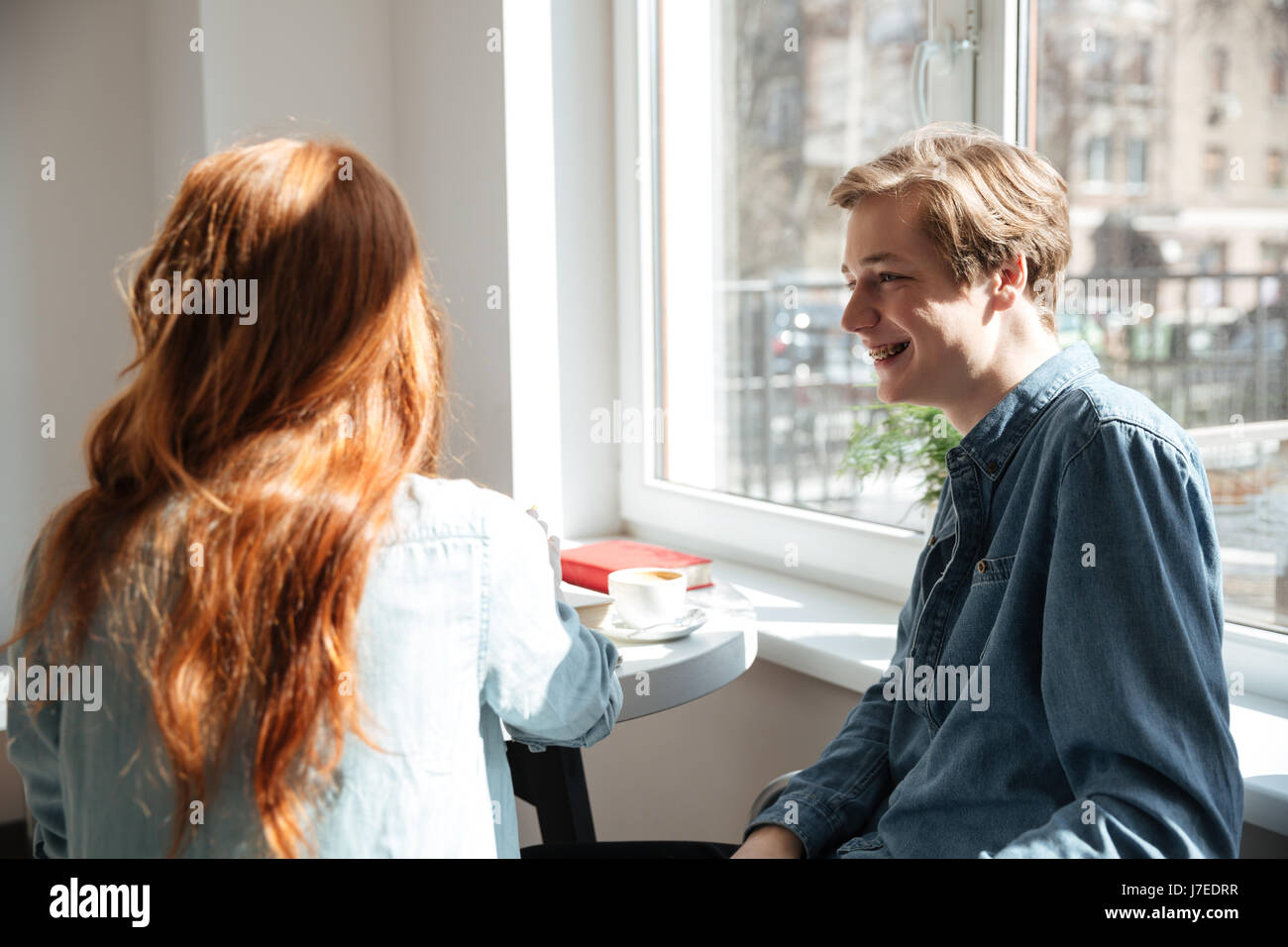Young smiling students man looking at his girlfriend Stock Photo - Alamy