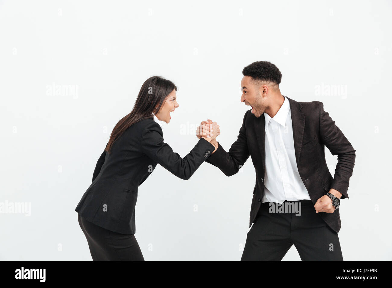 Image of screaming colleagues business team standing over white ...