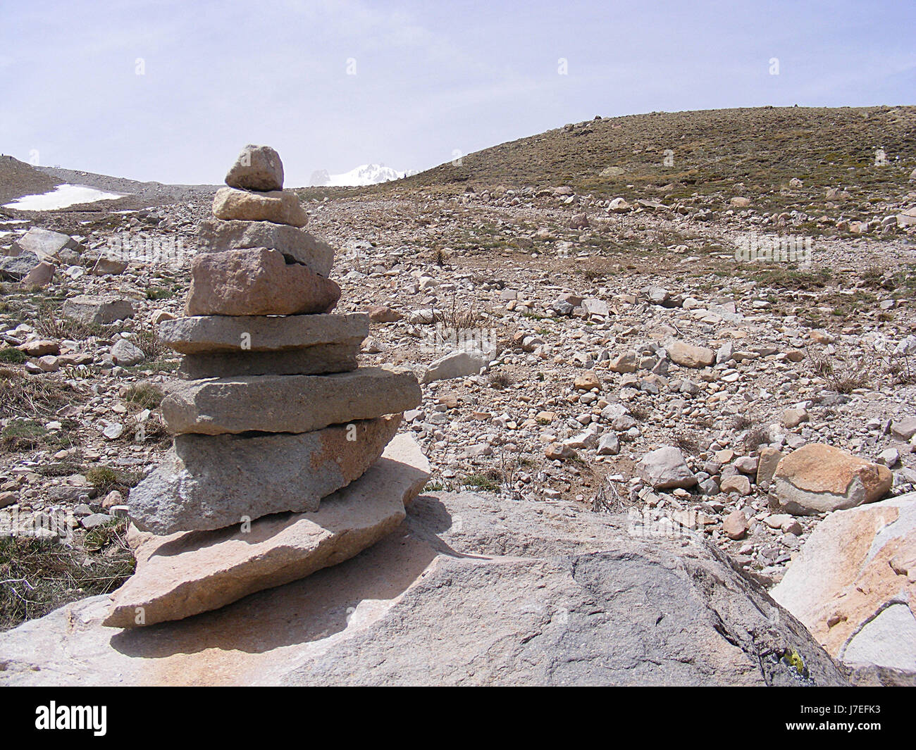 Making signs from the rocks, stacked stone clusters Stock Photo - Alamy