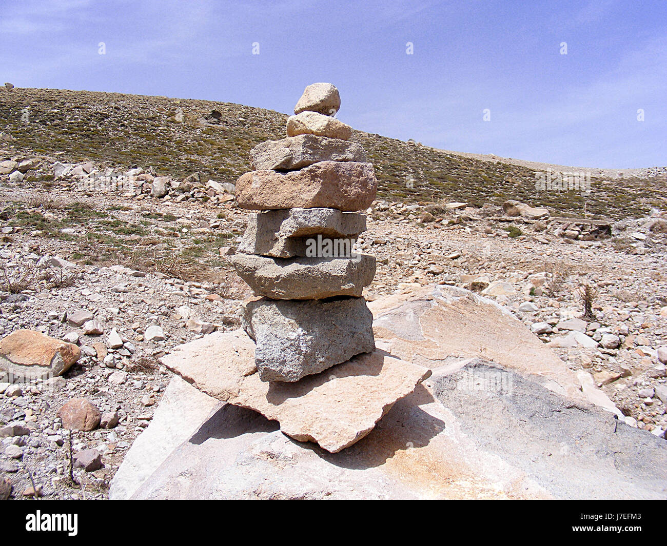 Making signs from the rocks, stacked stone clusters Stock Photo - Alamy