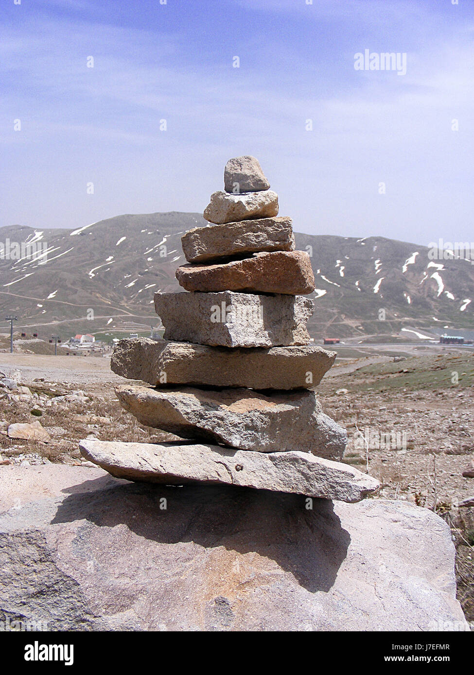 Making signs from the rocks, stacked stone clusters Stock Photo - Alamy