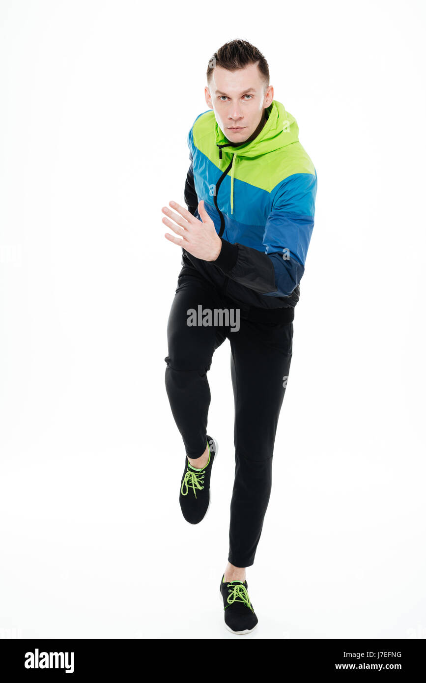 Picture of handsome strong sportsman running isolated over white ...