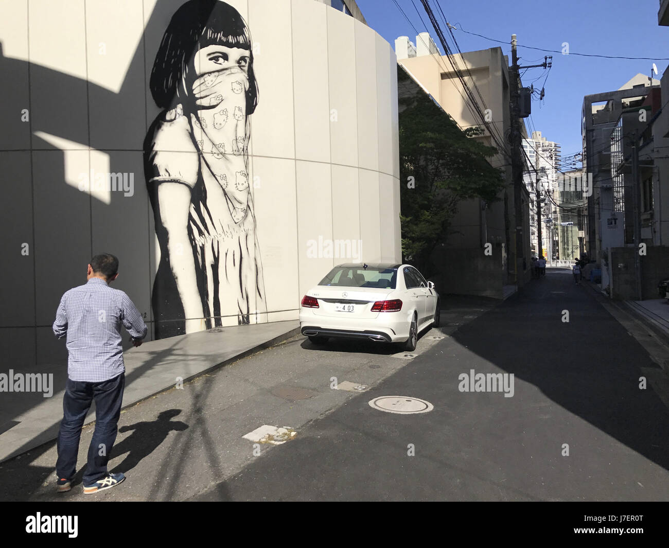 Tokyo, Japan. 23rd May, 2017. A mural of a girl with the face cover can ...