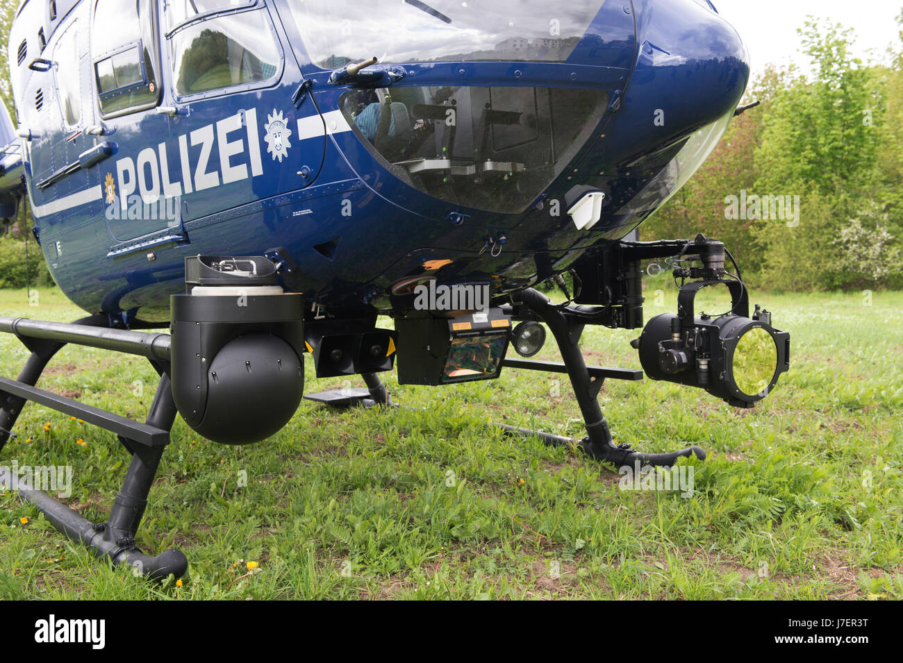 A Eurocopter EC 135 police helicopter seen on a meadow during a search ...