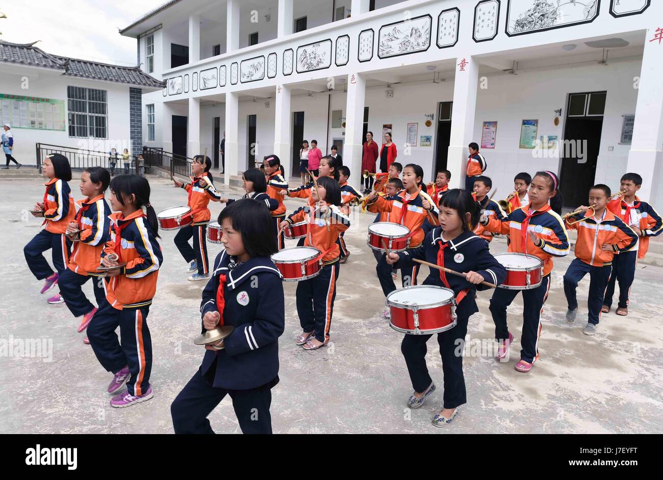 Yunlong, China's Yunnan Province. 19th May, 2017. Pupils play musical ...