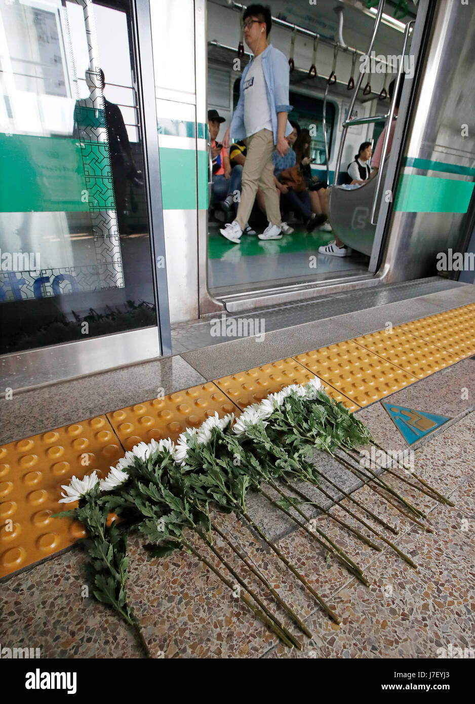 1st anniv. of tragic death at subway station Flowers are placed at a ...