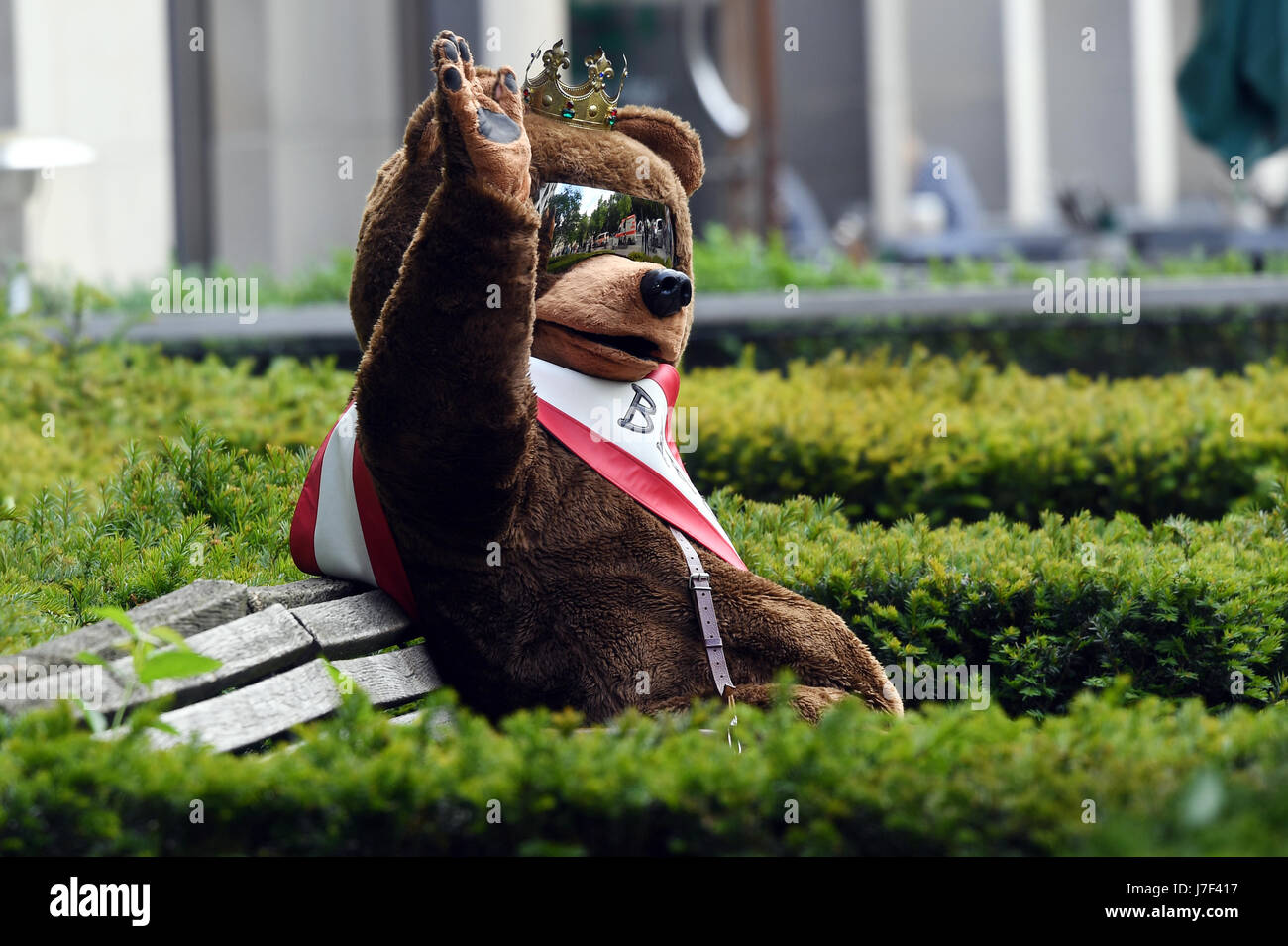 A man dressed as the Berlin Bear sits in a park in Berlin, Germany, 25 ...