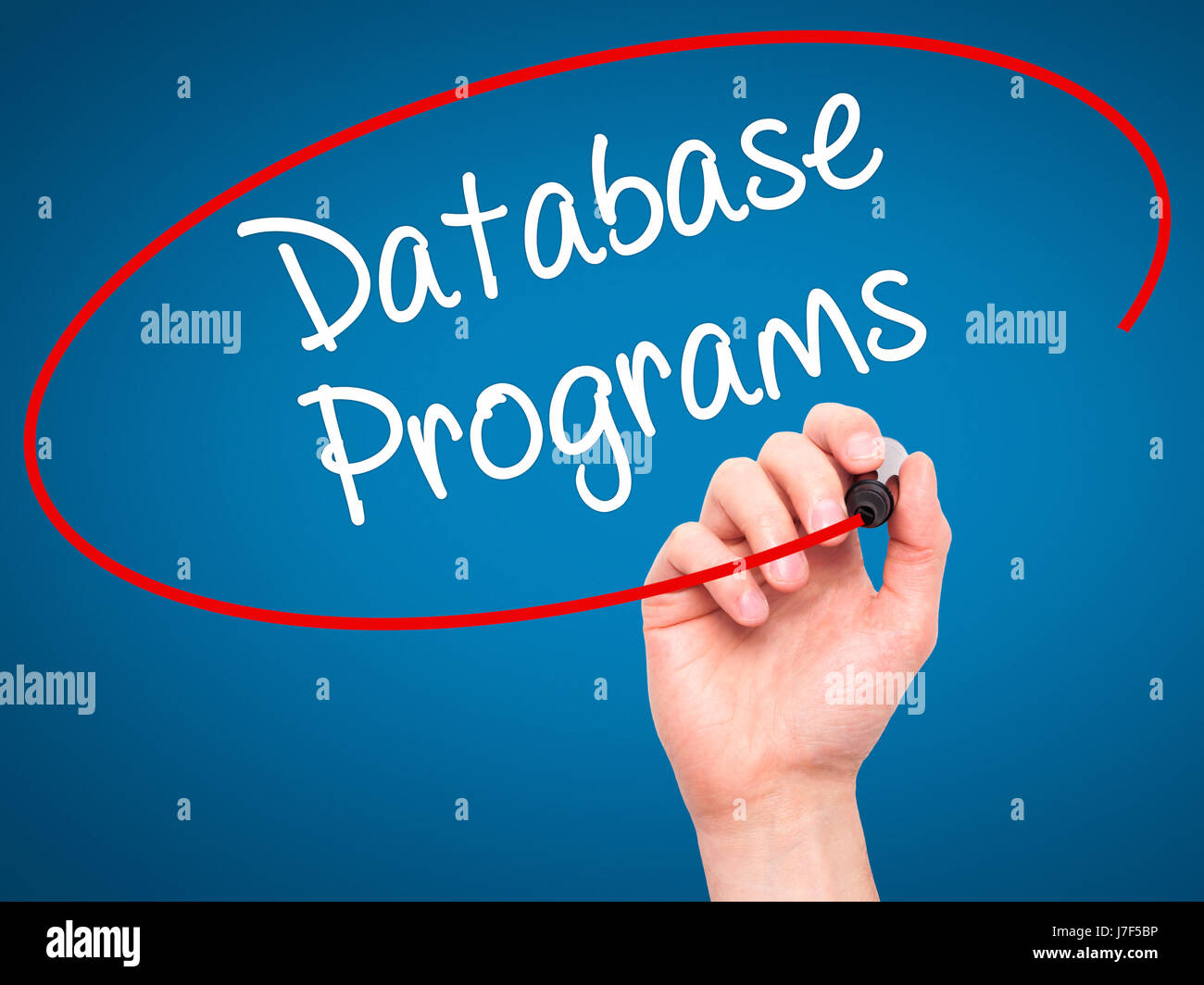 Man Hand writing Database Programs with black marker on visual screen ...