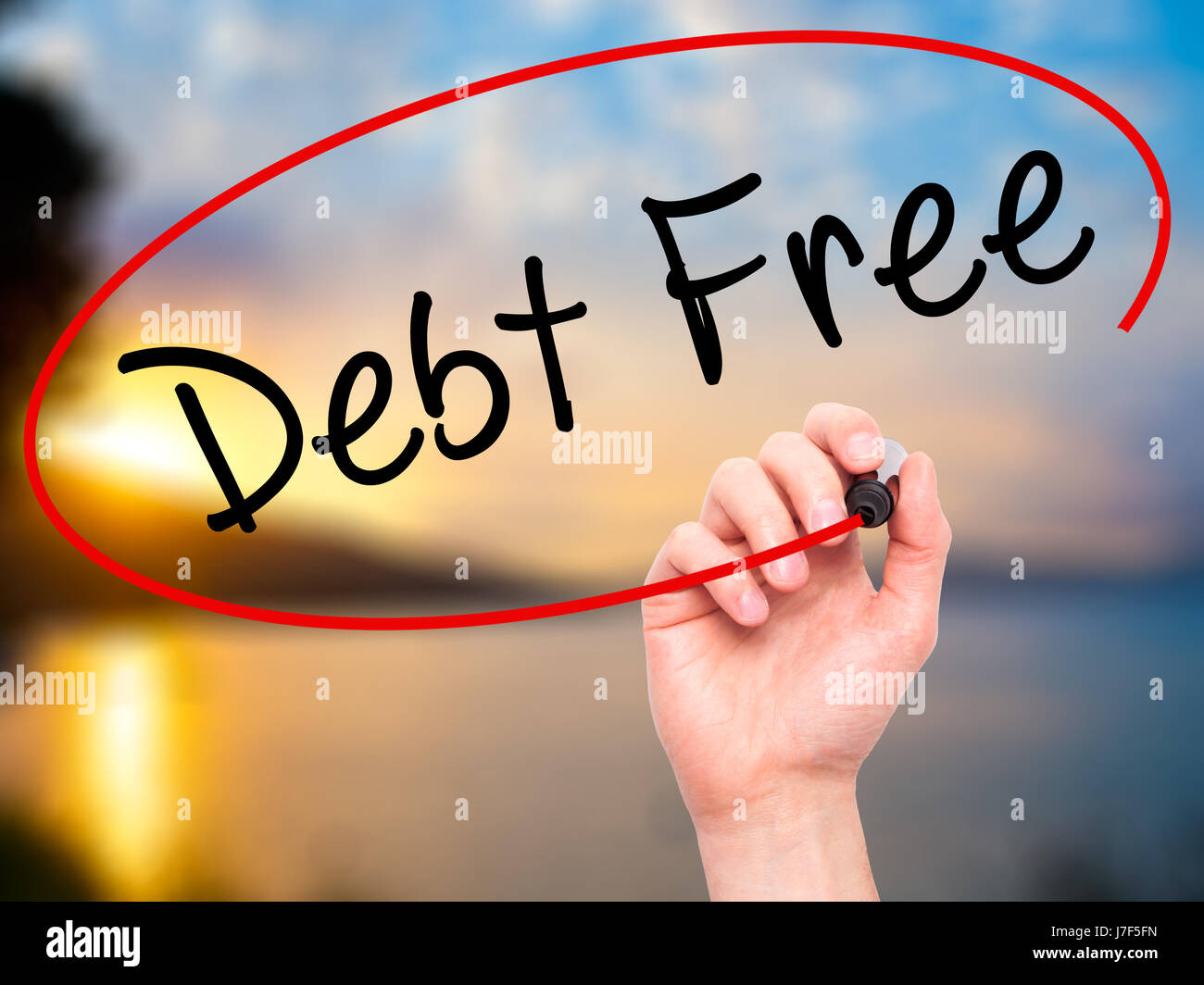 Man Hand writing Debt Free with black marker on visual screen. Isolated ...