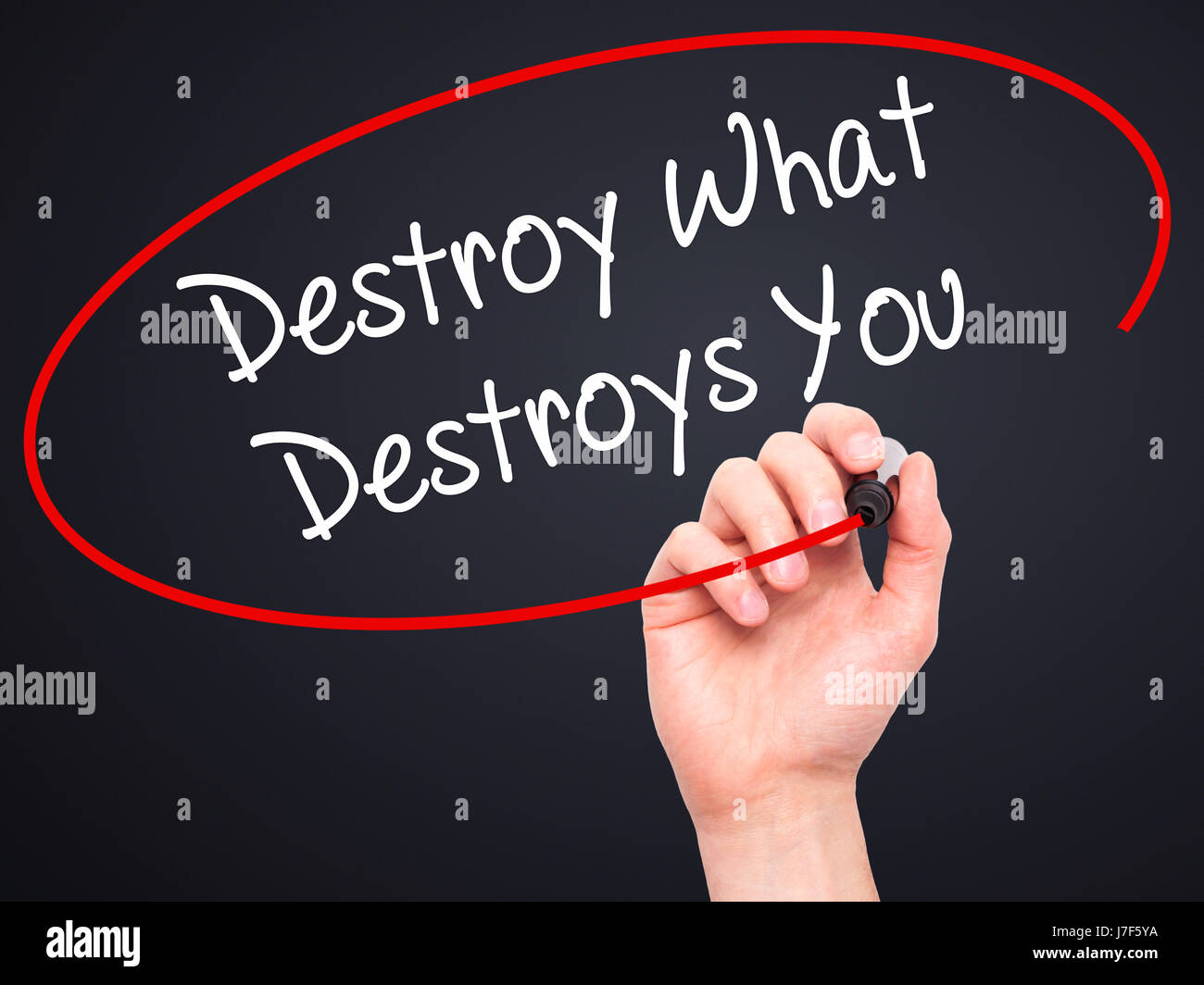 Man Hand writing Destroy What Destroys You with black marker on visual ...