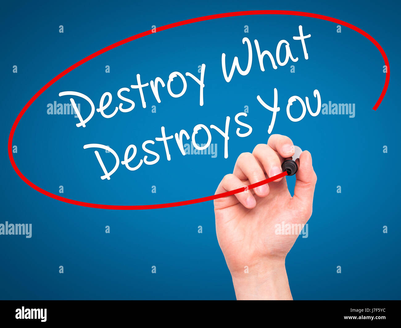 Man Hand writing Destroy What Destroys You with black marker on visual ...