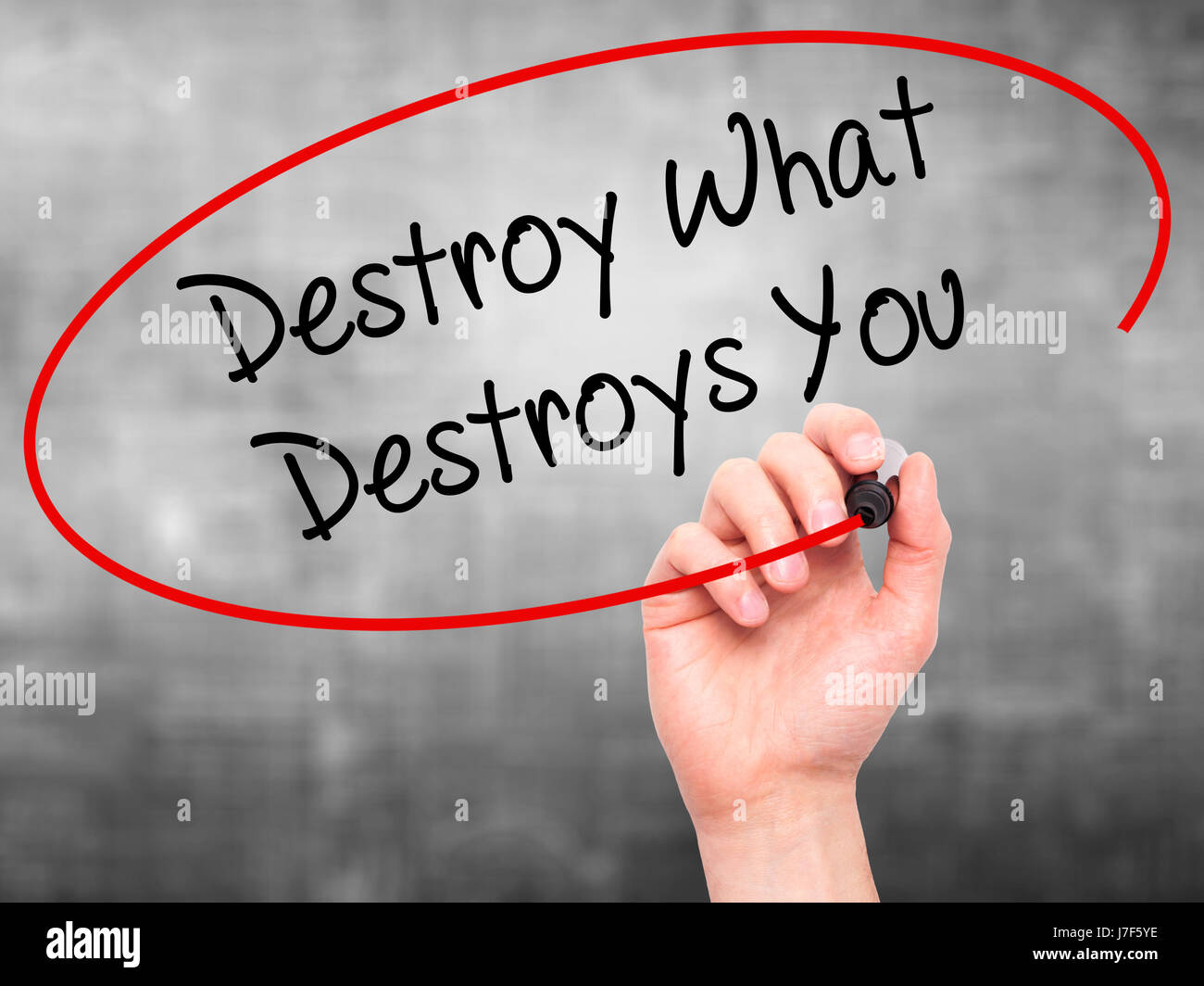 Man Hand writing Destroy What Destroys You with black marker on visual ...
